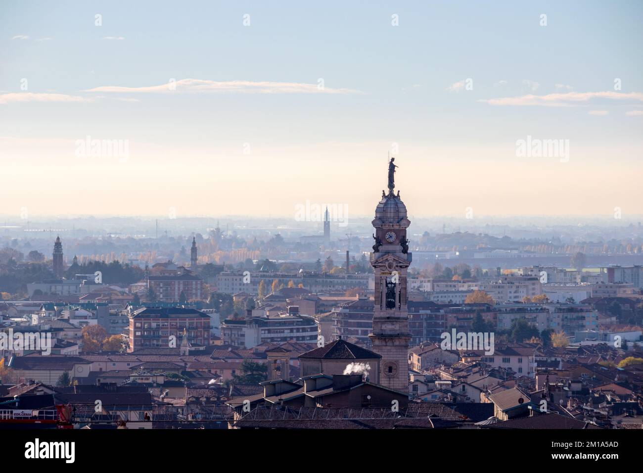Bergamo old town on top of a hill with blue sky and mountains in the ...