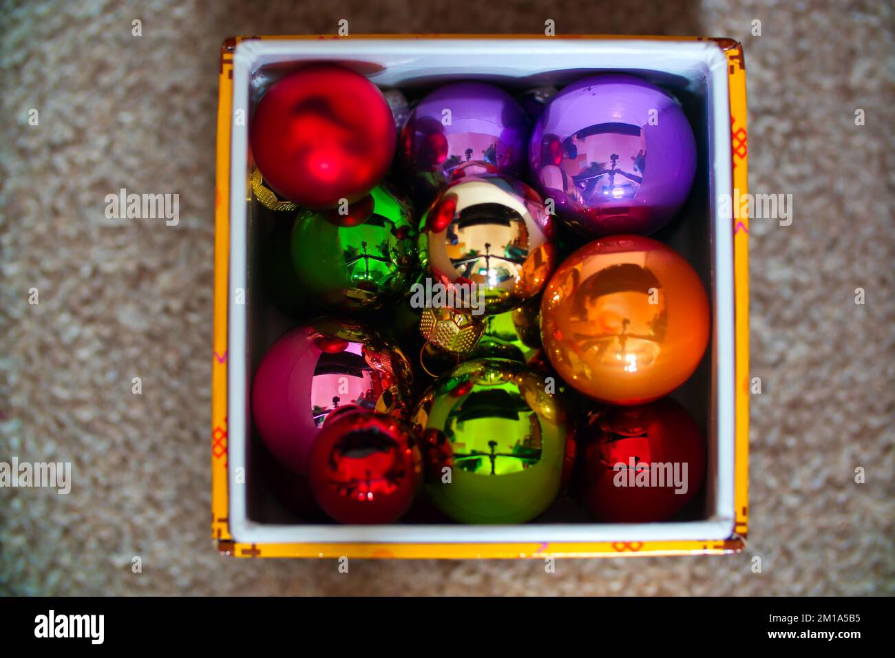 Box of coloured baubles Stock Photo - Alamy