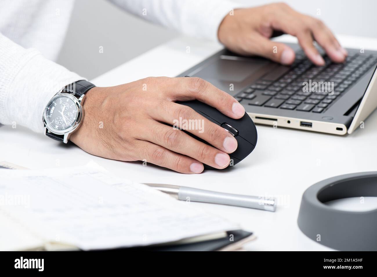 Black vertical optical computer mouse with ergonomic design. This mouse ...