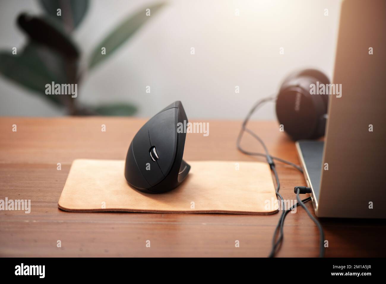 Black vertical optical computer mouse with ergonomic design. This mouse ...