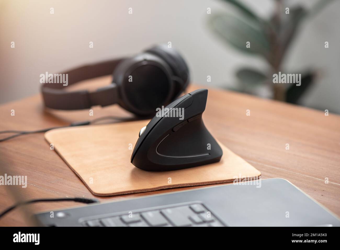 Black vertical optical computer mouse with ergonomic design. This mouse ...