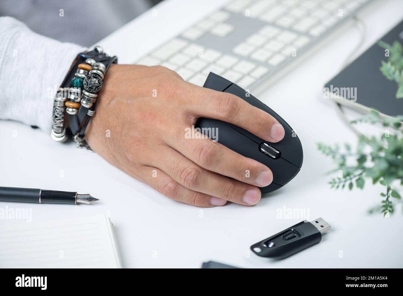 Black vertical optical computer mouse with ergonomic design. This mouse ...