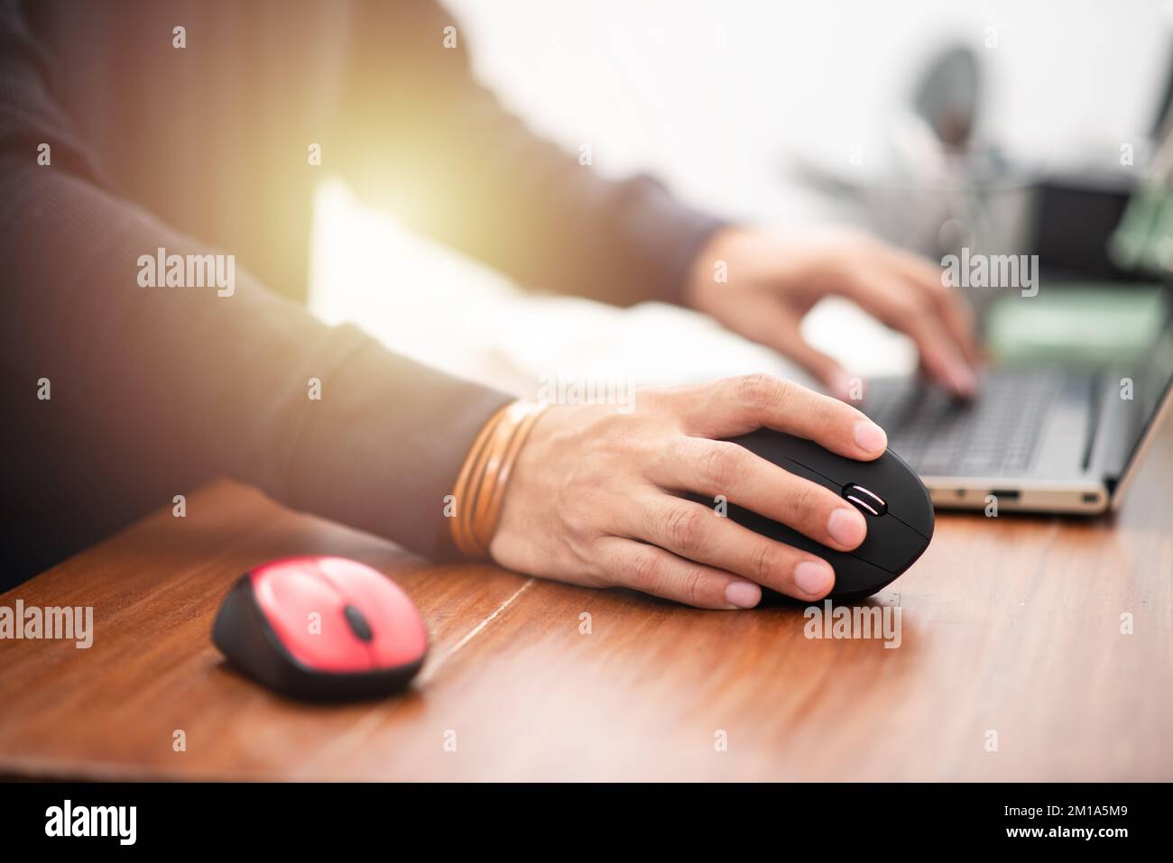 Black vertical optical computer mouse with ergonomic design. This mouse ...