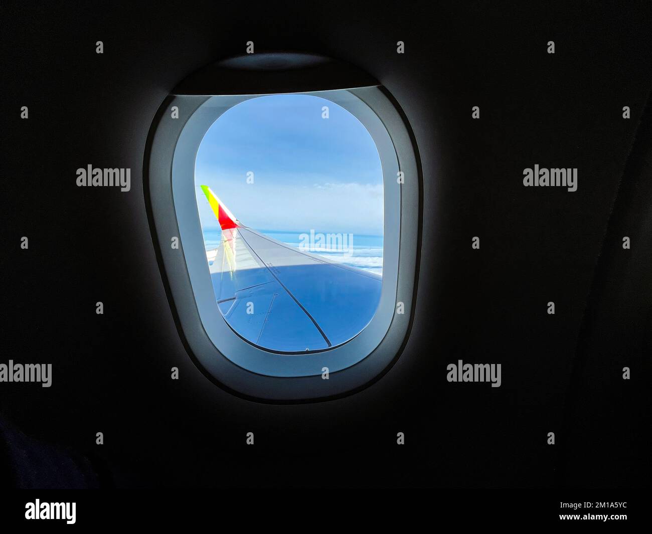 Window view of airplane wing while flying Stock Photo - Alamy