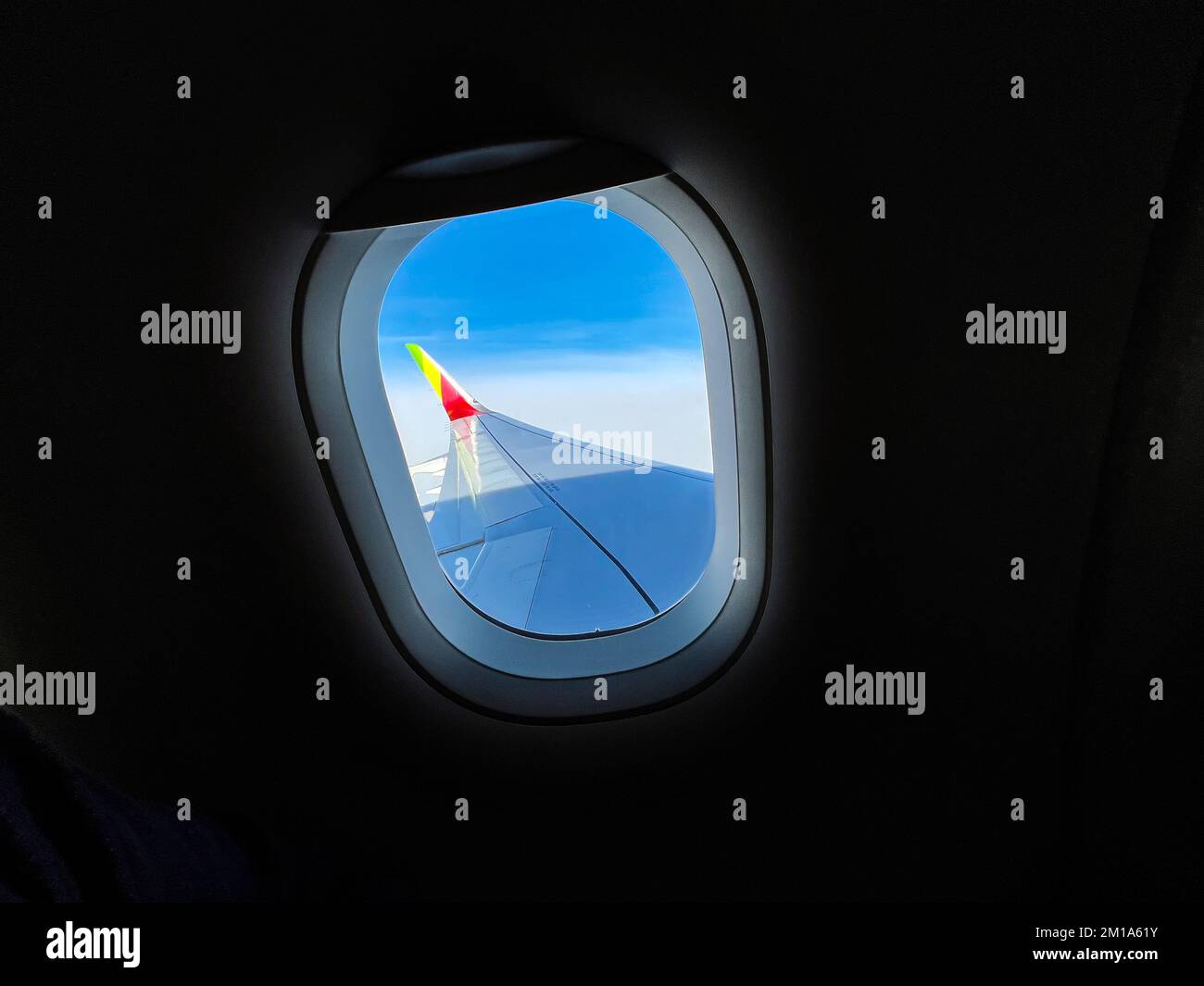 Window view of airplane wing while flying Stock Photo - Alamy