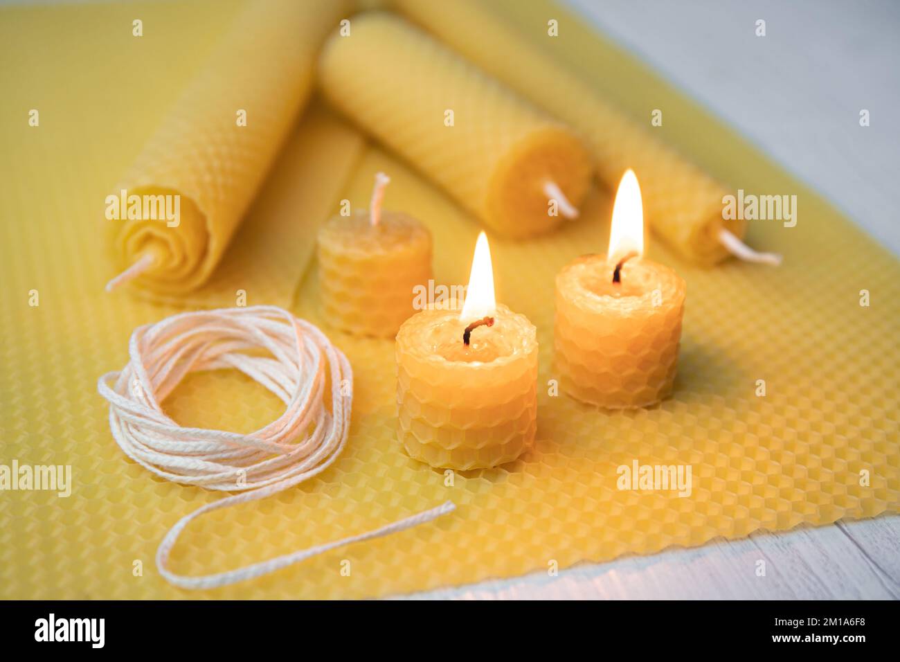 Natural rolled beeswax candles from pressed beeswax honeycomb sheet at ...