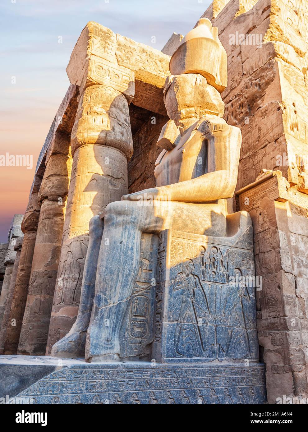 Seated Rameses II Statue at the entrance of Luxor Temple, Egypt Stock ...