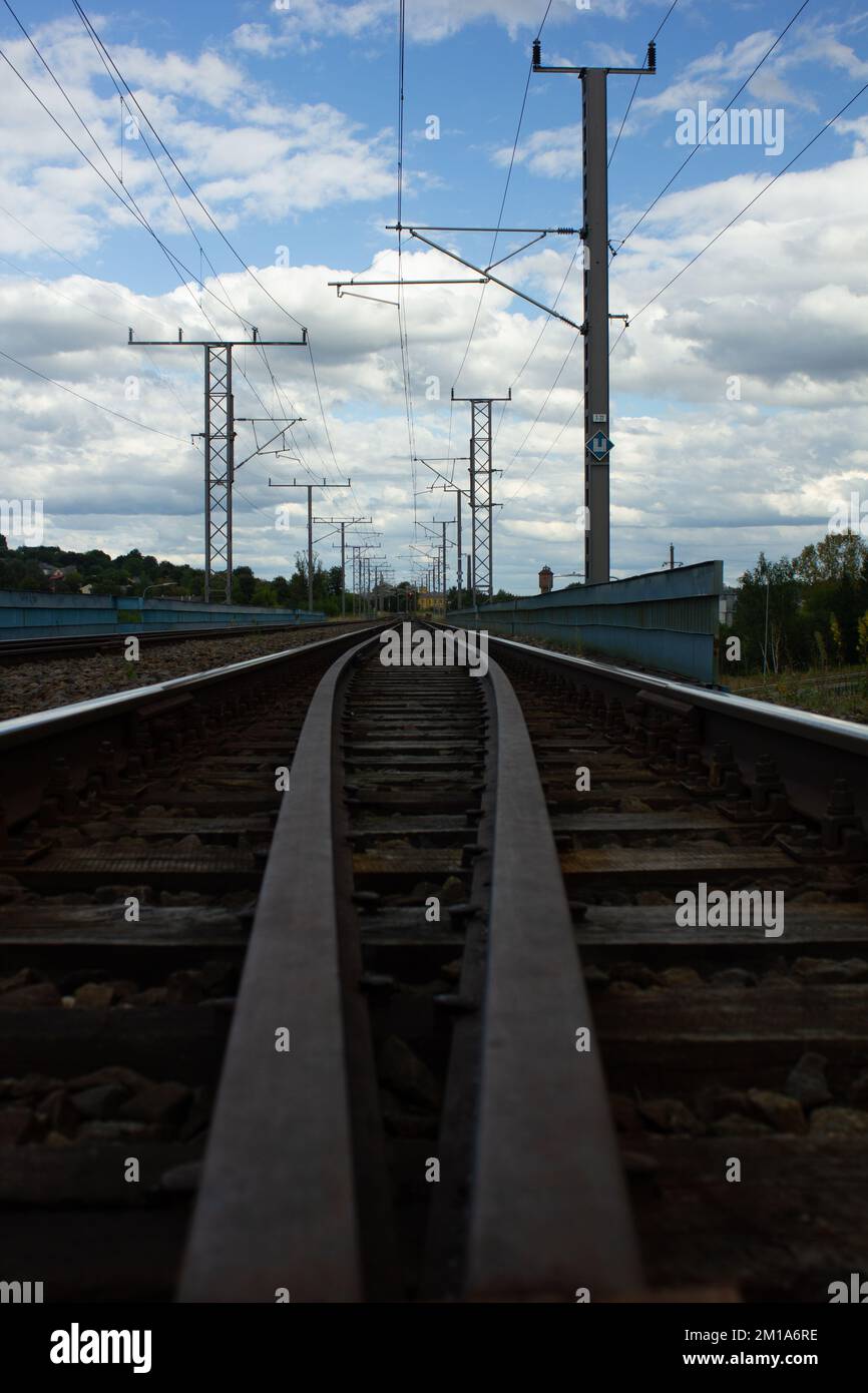 A vertical shot of train tracks stretching into the distance Stock ...