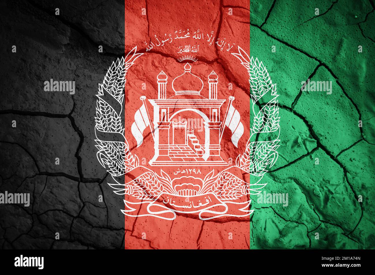 Flag of Afghanistan. Afghanistan symbol. Flag on the background of dry ...