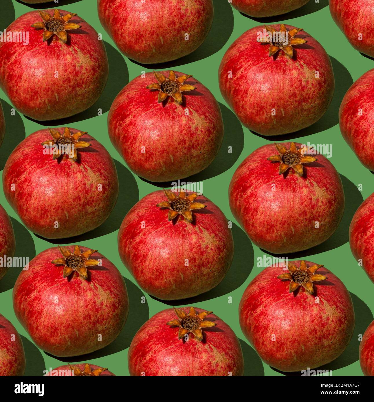 Pomegranate pattern. Red pomegranates on a green background. Fruit food ...