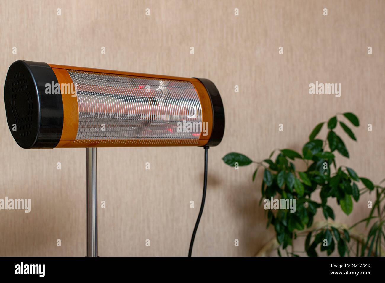 Infrared electric heater on the counter in the room Stock Photo - Alamy