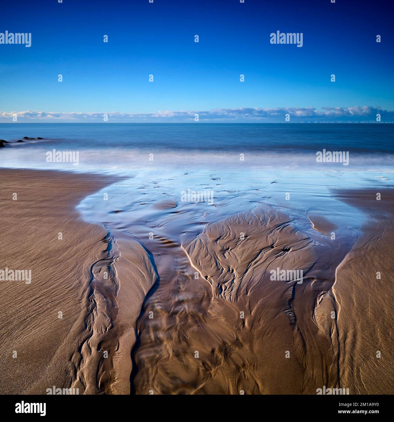 Water channels draining into sea after hight tide Stock Photo - Alamy