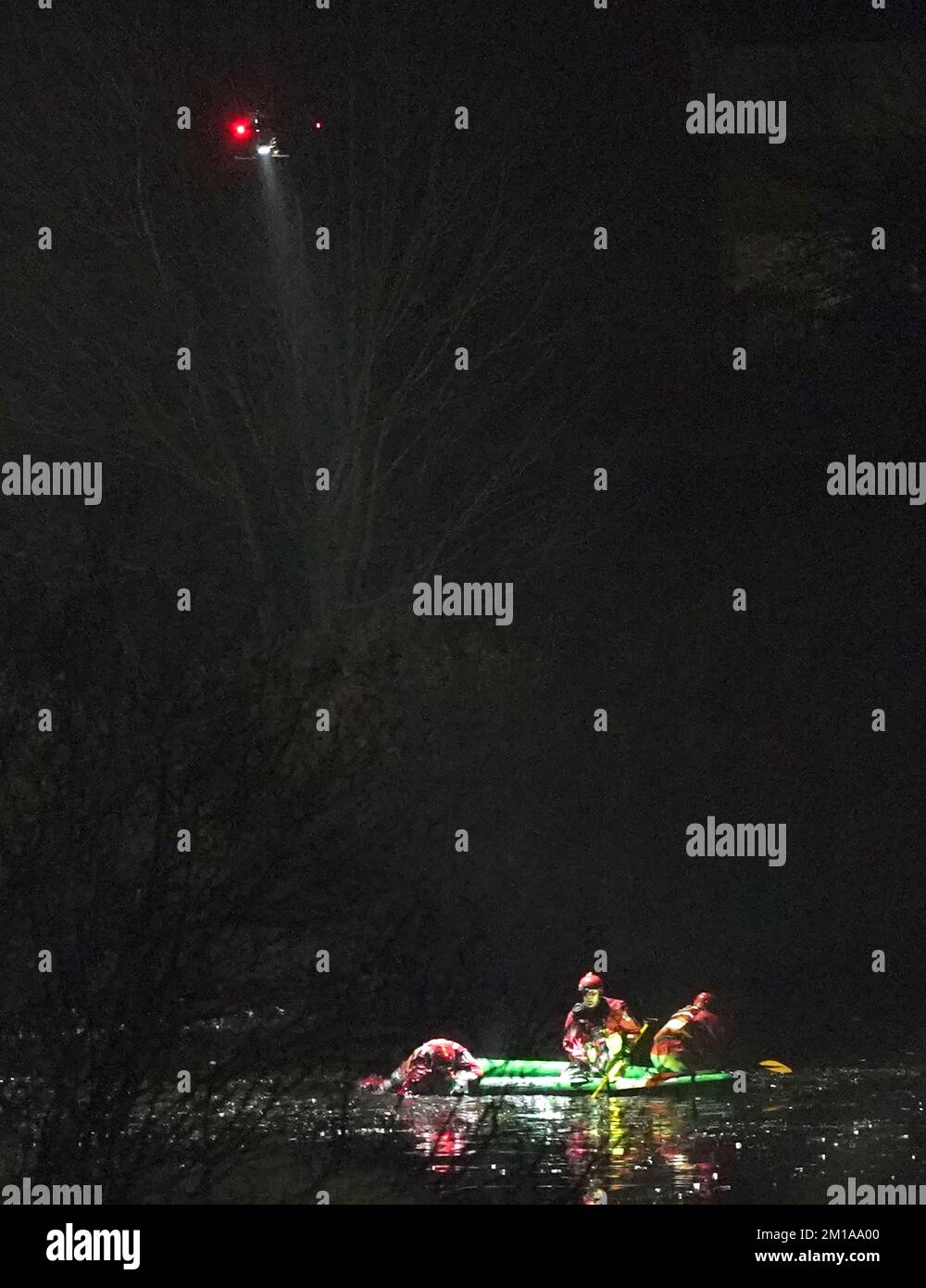Emergency personnel search the lake at the scene in Babbs Mill Park in ...
