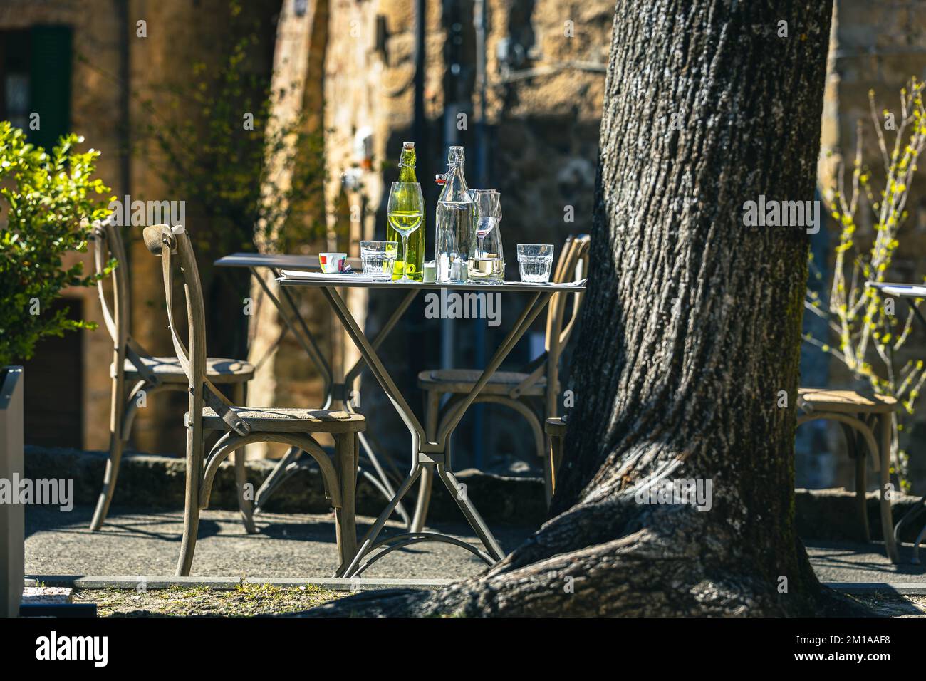restaurant table in an old medieval old town of Tuscany Stock Photo - Alamy