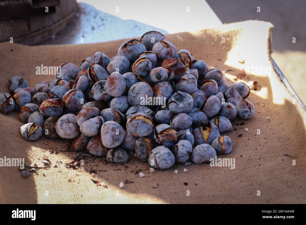 Roasted chestnuts sold at streets of Lisbon, Portugal Stock Photo - Alamy