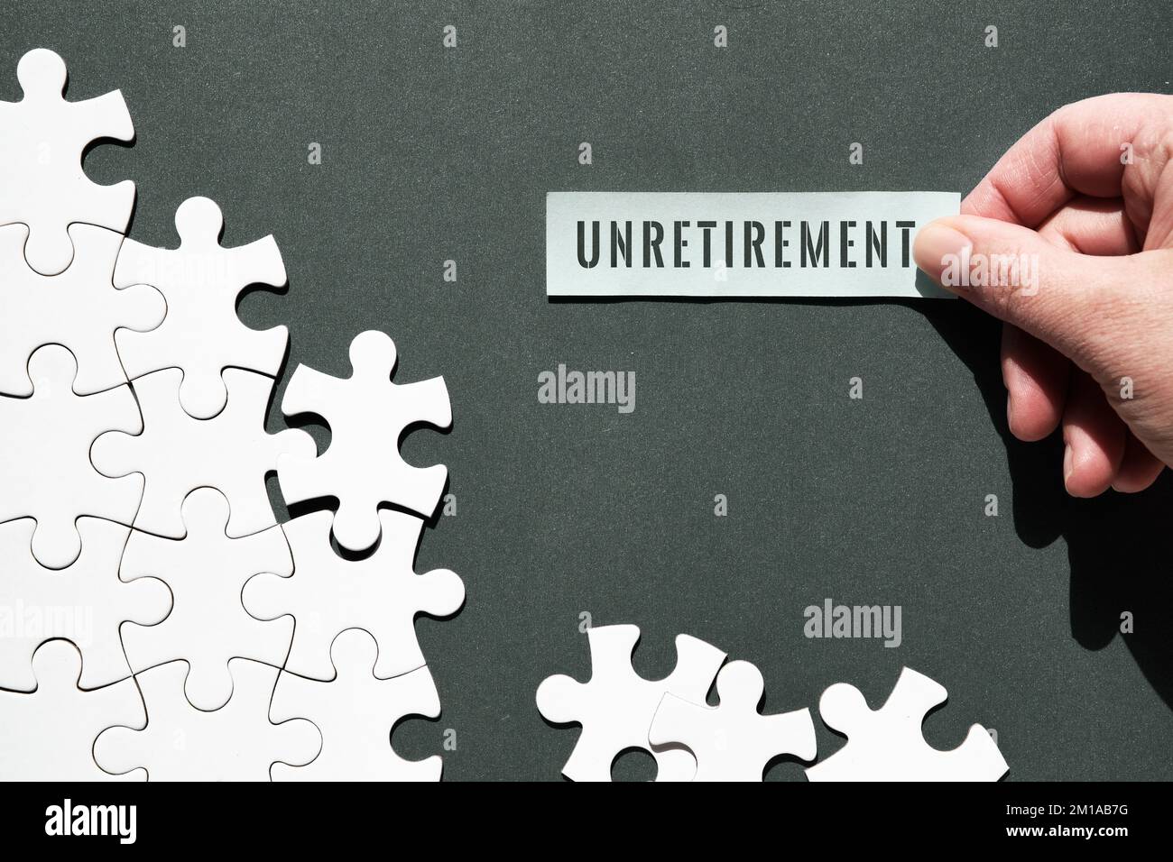 Unretirement concept image. Puzzle pieces half assembled and separate ...