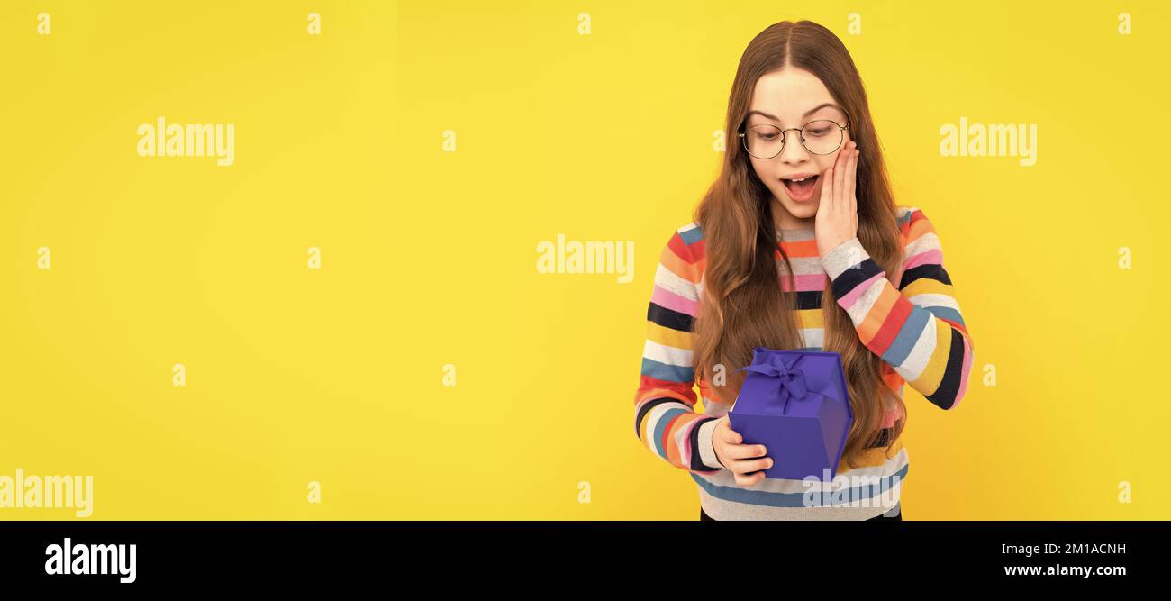 surprised child in eyeglasses hold gift box for birthday, birthday ...
