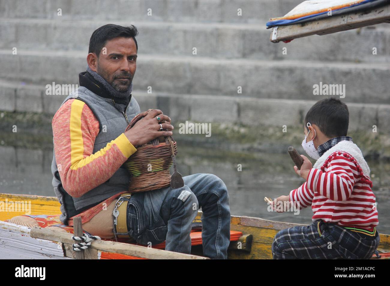 Junaid Ahmad Wani, a physically abled Shikara rider paddling his ...
