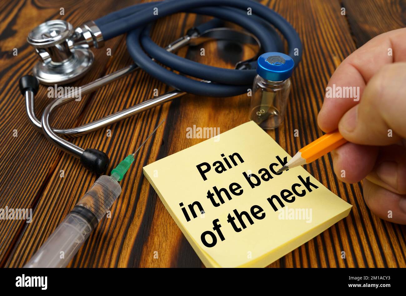 Medical concept. On the table is a stethoscope, a syringe, a man's hand ...