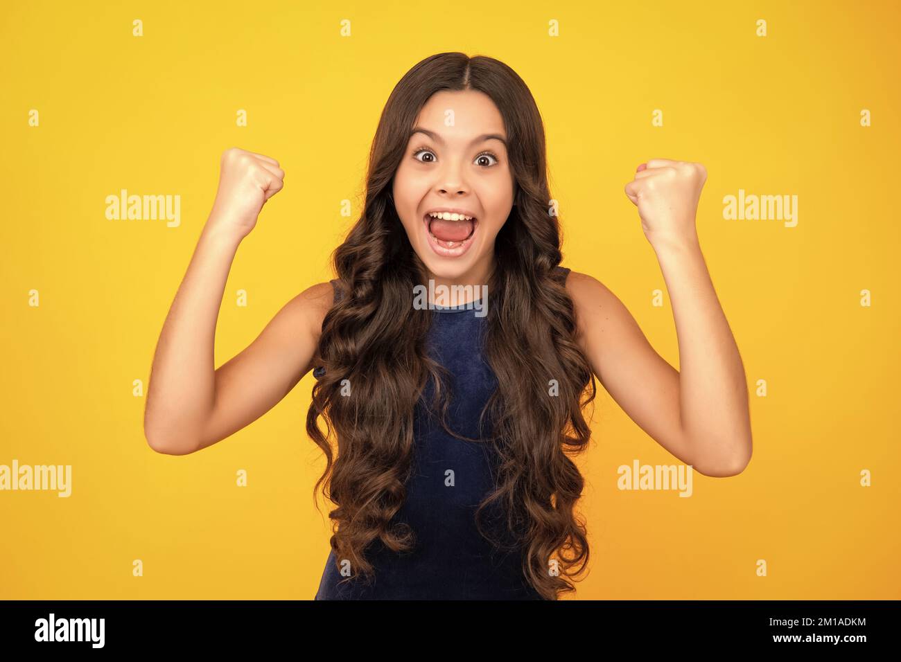 Amazed teen girl. Excited expression, cheerful and glad. Joy, victory ...