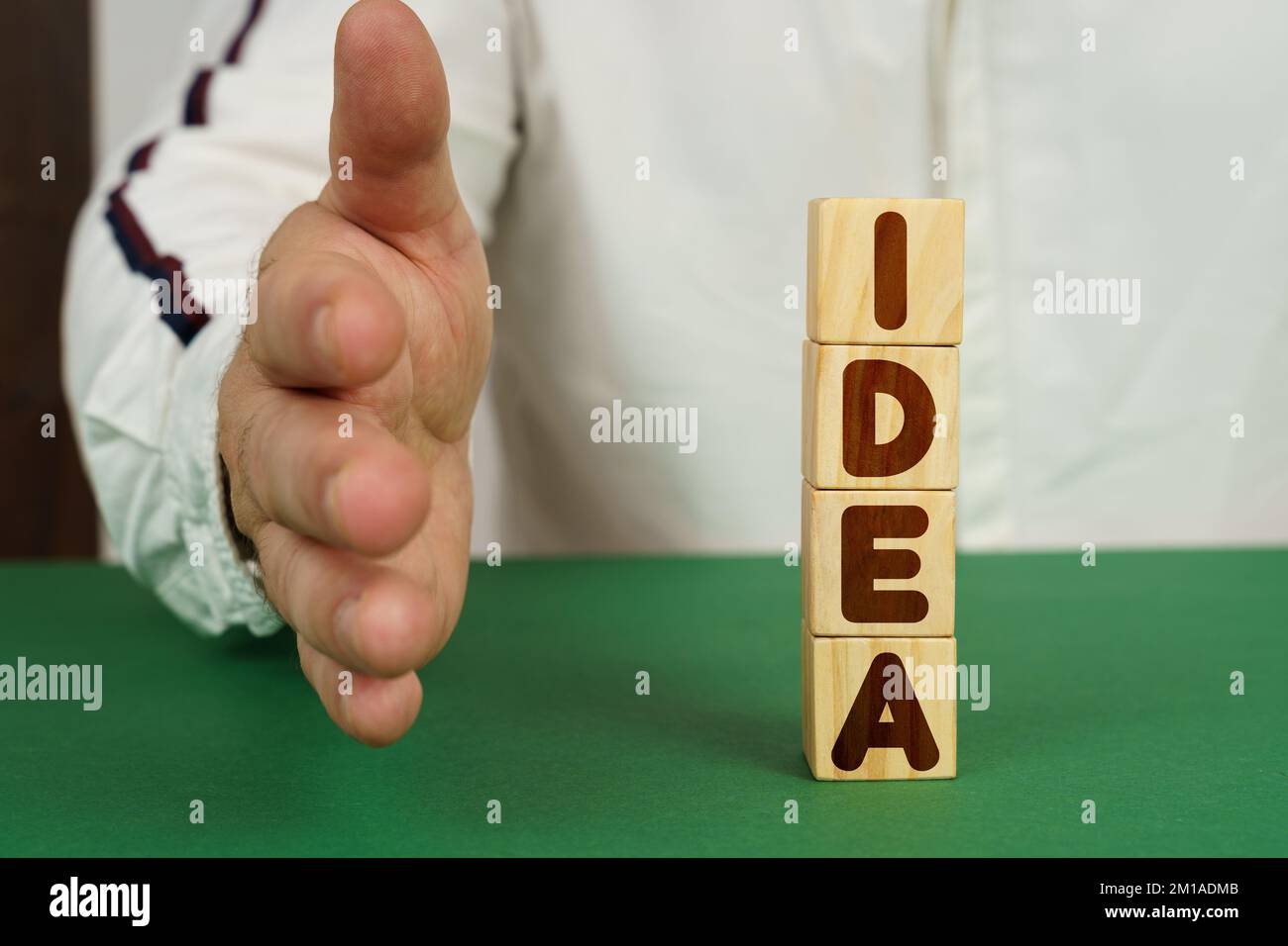 Business concept. On a green surface, cubes with the inscription - IDEA ...