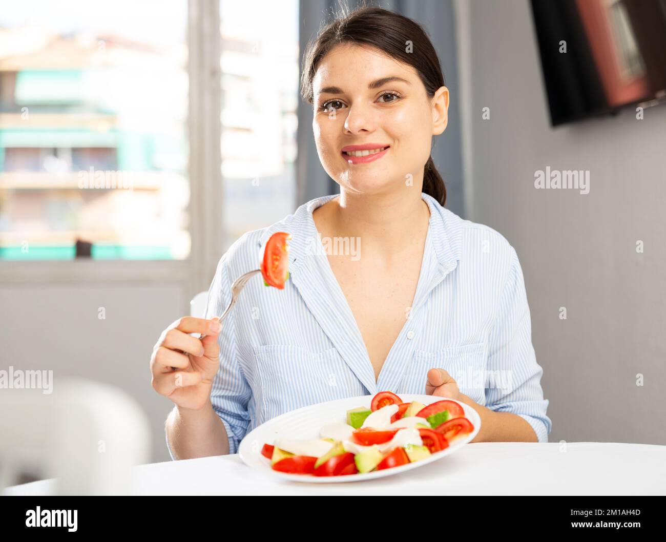 Woman eating dietary salad hi-res stock photography and images - Alamy