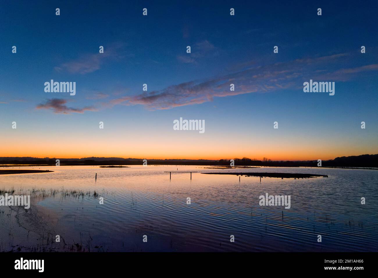 View from East Hide across Scrape at sunset, RSPB Minsmere Nature ...