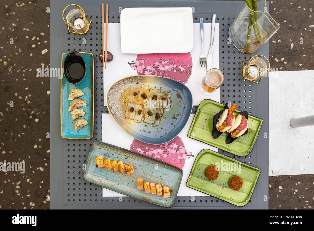 A top view of different types of traditional Asian dishes served at a ...