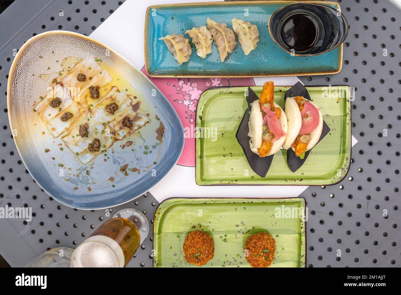 A top view of different types of traditional Asian dishes served at a ...