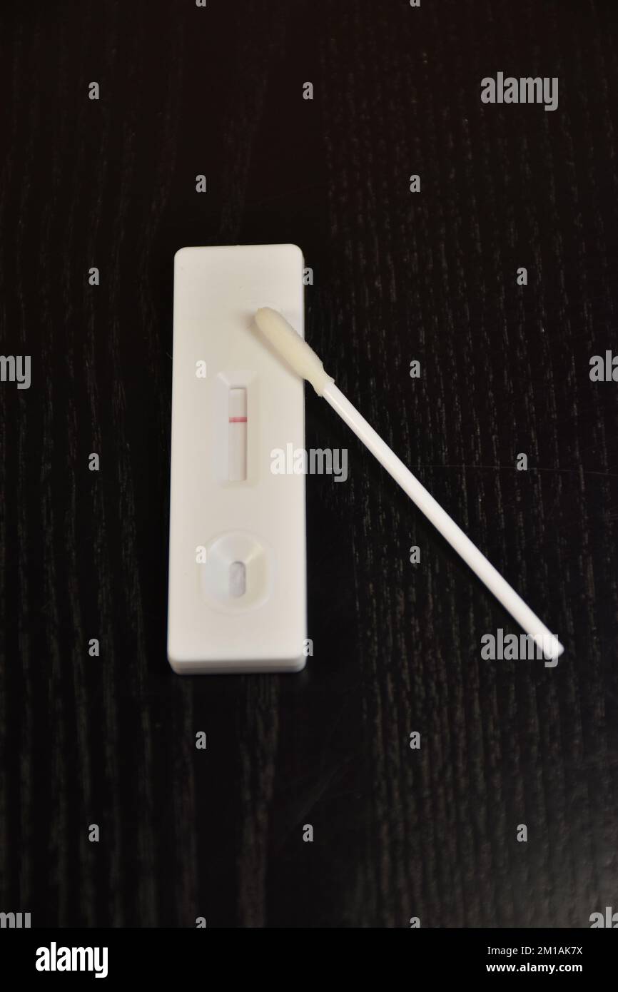 Negative coronavirus rapid self-testing kit in black background Stock ...