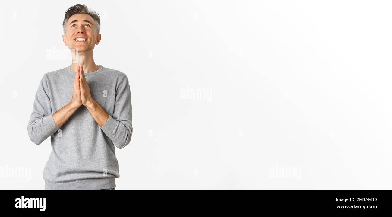 Image of nervous middle-aged man begging God, looking up and pleading ...