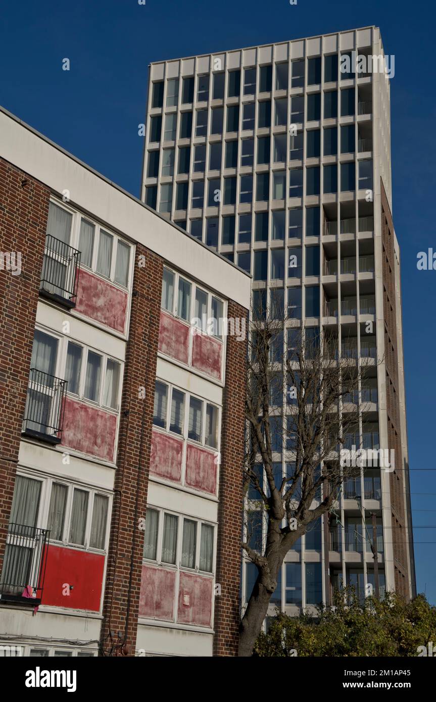 Old housing estate opposite new apartment tower block in Hackney,London ...