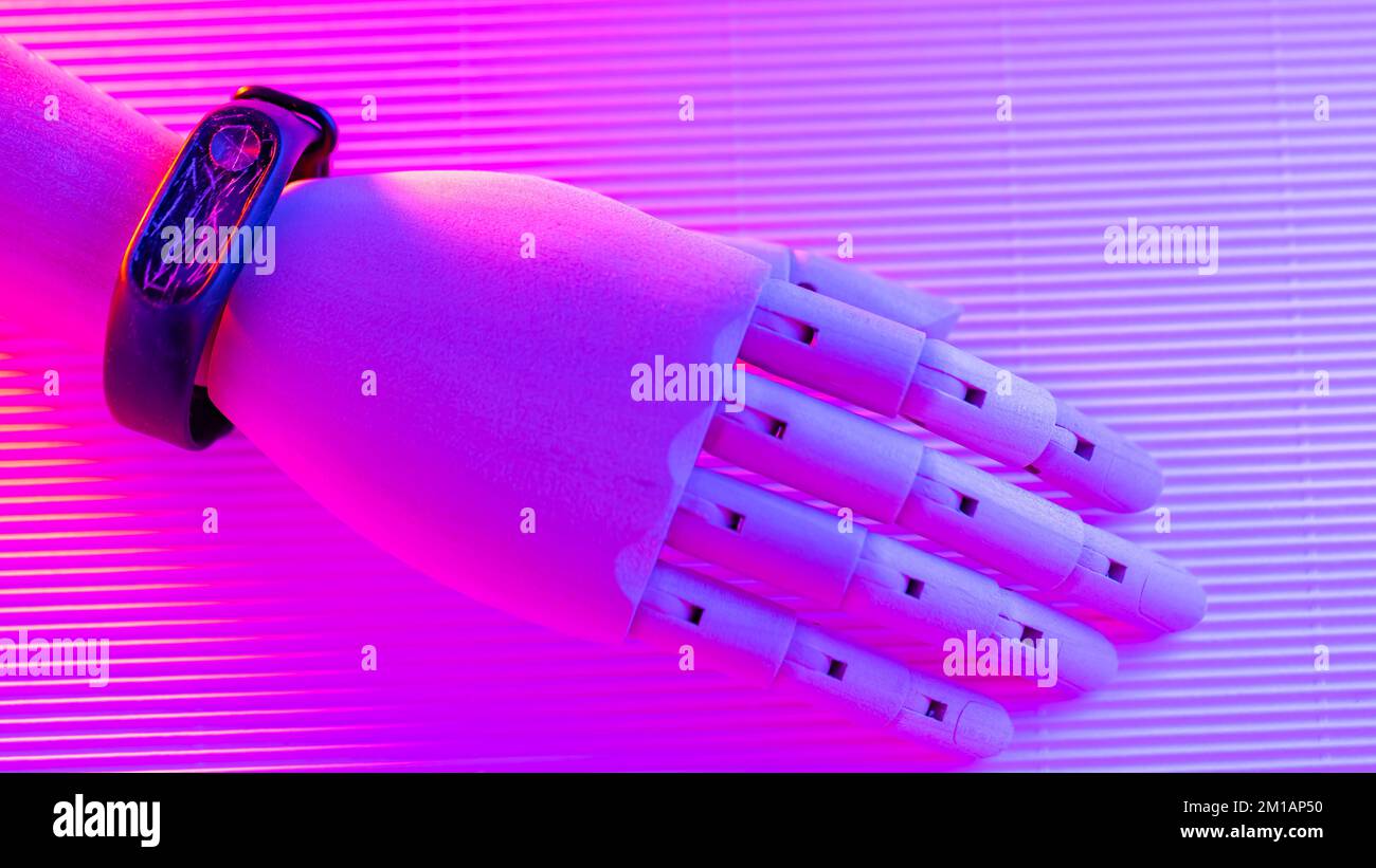 Fitness tracker with broken display on an artificial hand. Concept of ...
