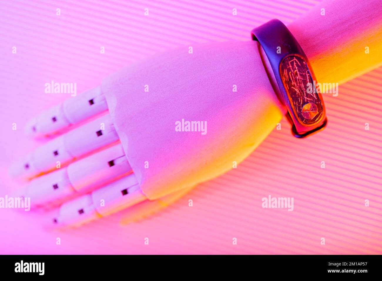 Fitness tracker with broken display on an artificial hand. Concept of ...