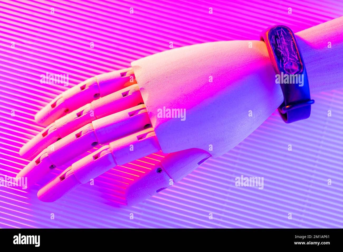 Fitness tracker with broken display on an artificial hand. Concept of ...