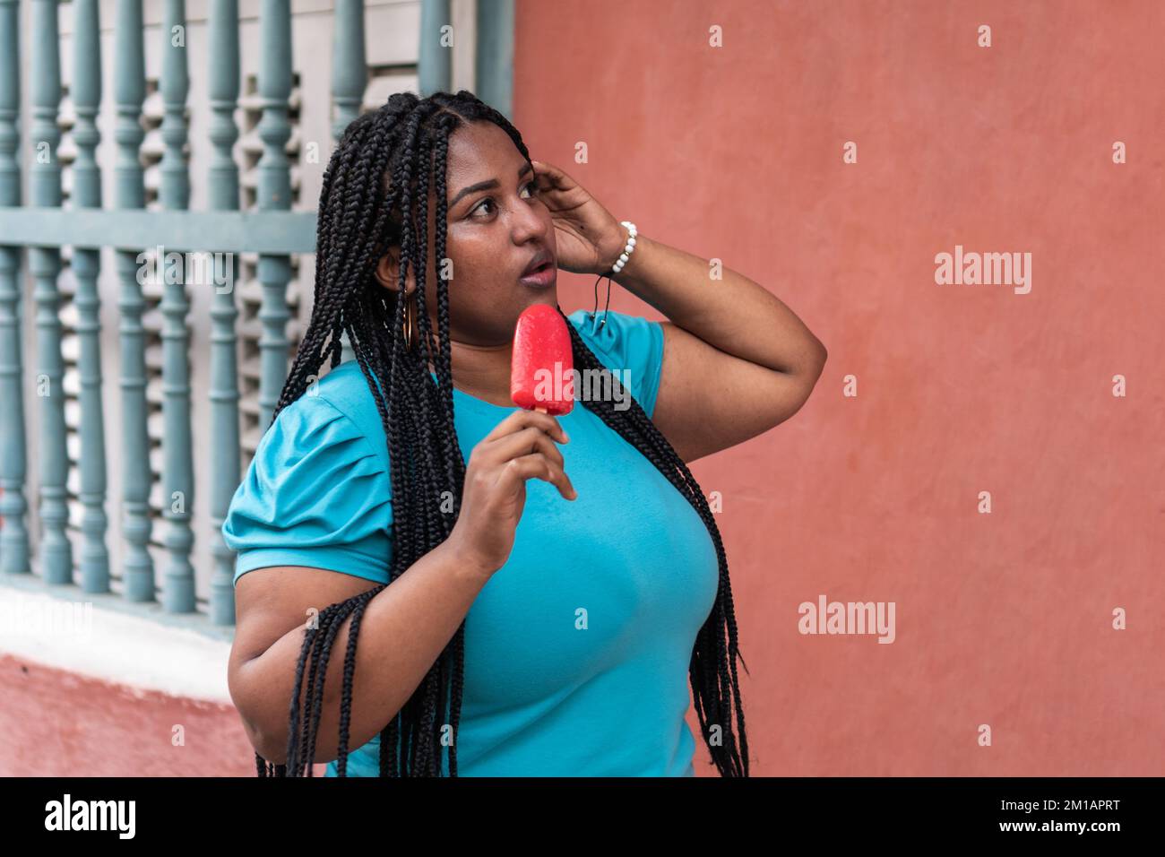 Young woman eating popsicle hi-res stock photography and images - Alamy
