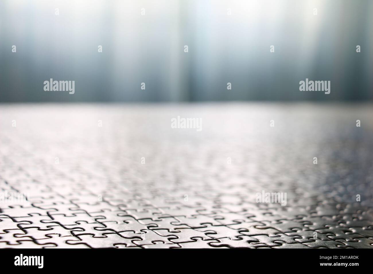 Close-up of a jigsaw puzzle pieces in assembled state perspective view ...