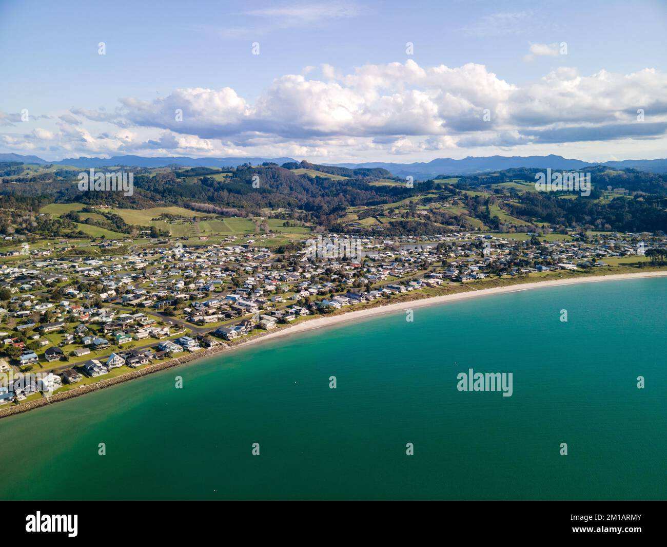 An aerial view of the sea and Cooks Beach, Coromandel Peninsula in New ...