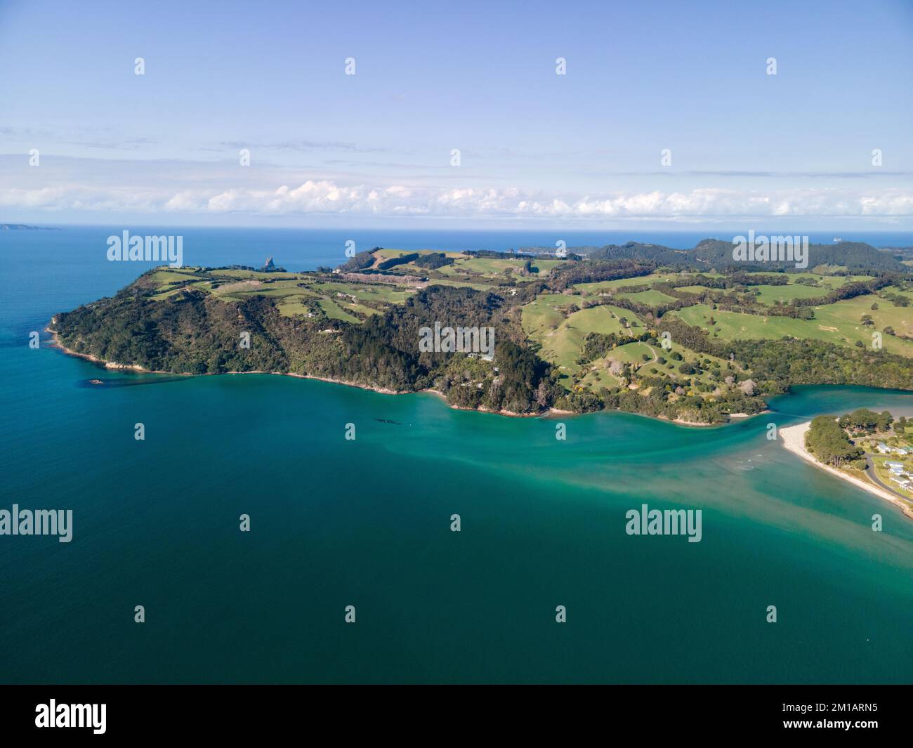 An aerial view of the sea and Cooks Beach, Coromandel Peninsula in New ...
