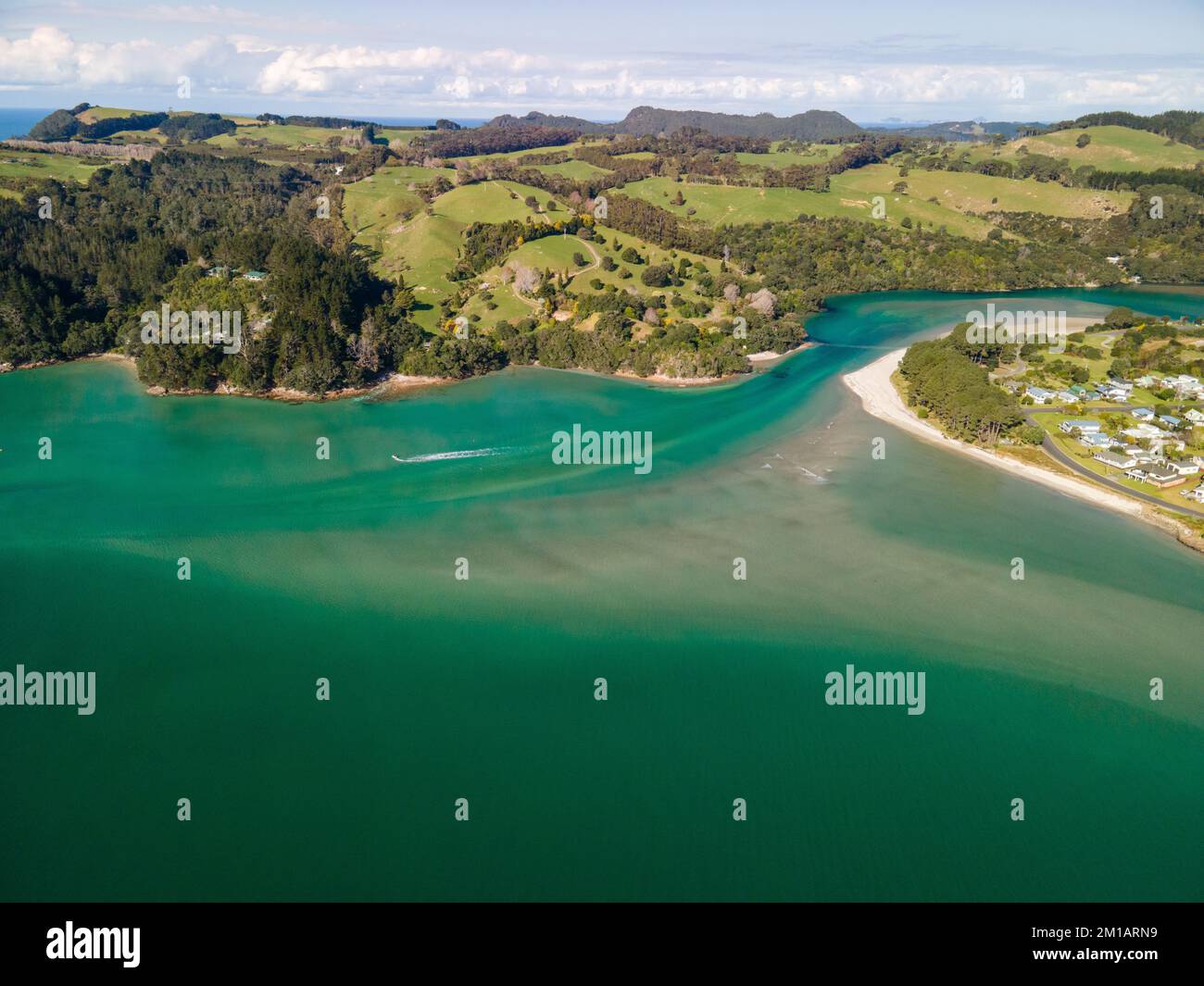 An aerial view of the sea and Cooks Beach, Coromandel Peninsula in New ...