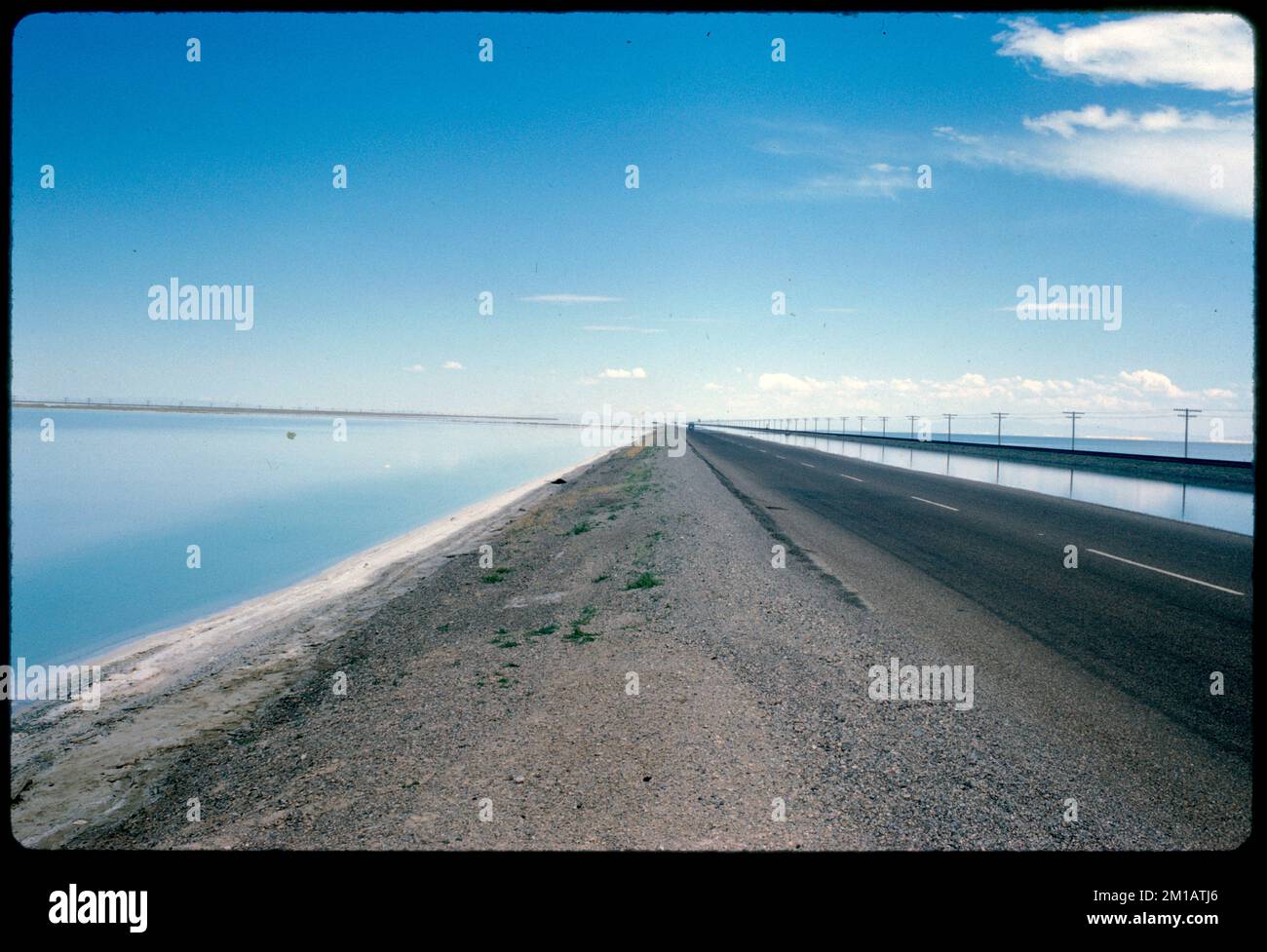 View down Interstate 80 across Bonneville Salt Flats, Utah , Roads, Lakes & ponds. Edmund L ...