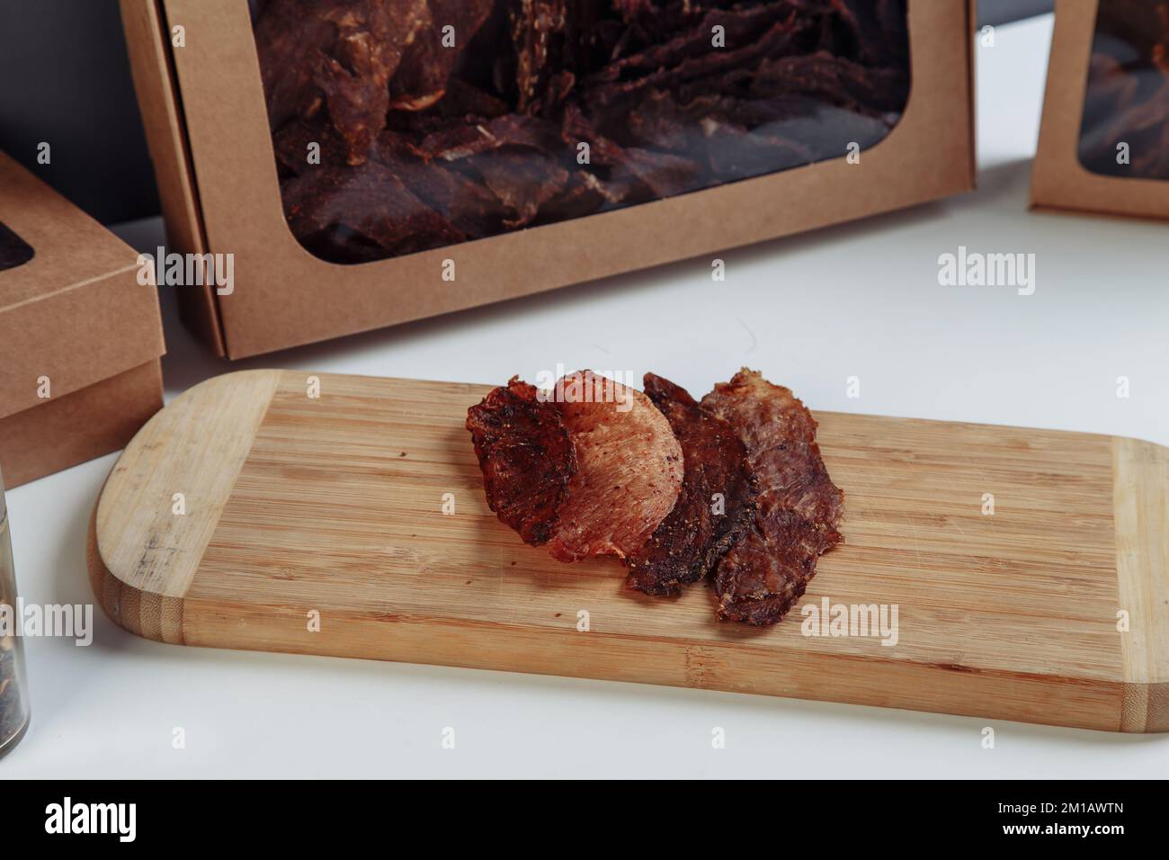 Some craft cardboard boxes with dehydrated dog treats, the highest one ...