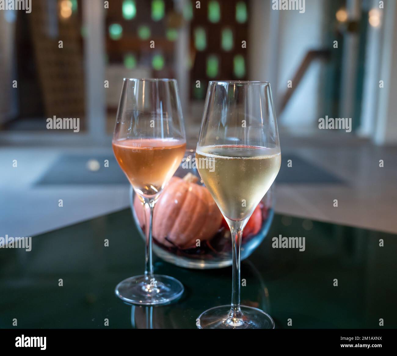 Tasting of brut and rose champagne sparkling wine produced by traditional method in underground ...