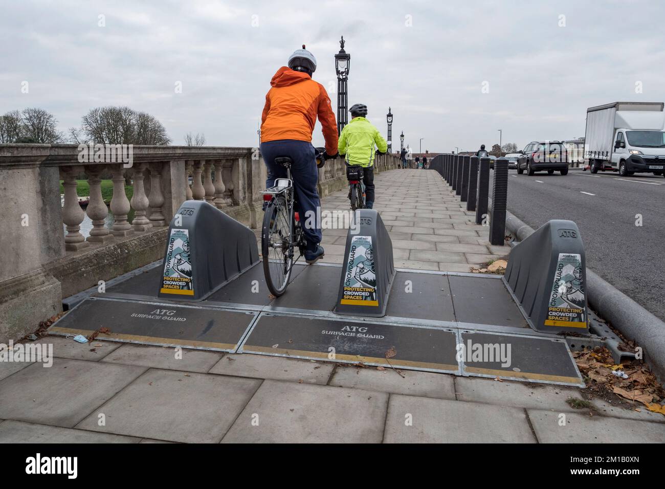 Cyclists passing through a Crowdguard ATG Surface Guard HVM security ...
