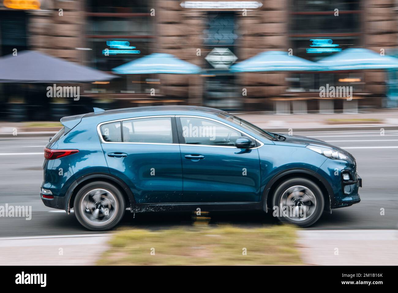 Ukraine, Kyiv - 2 August 2021: Blue KIA Sportage car moving on the ...