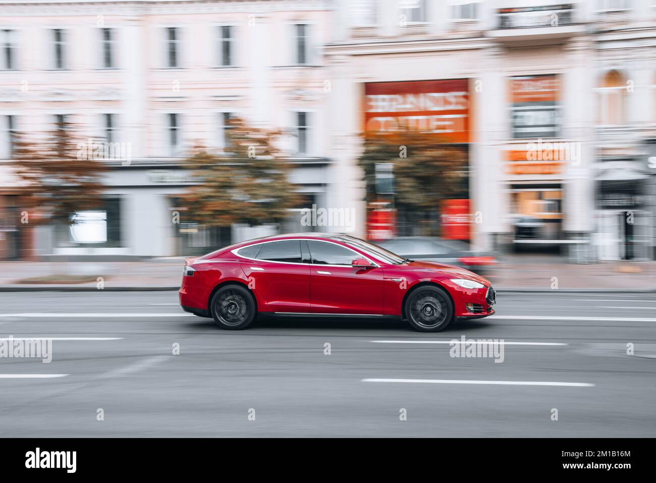 Ukraine, Kyiv - 2 August 2021: Red TESLA Model S car moving on the ...