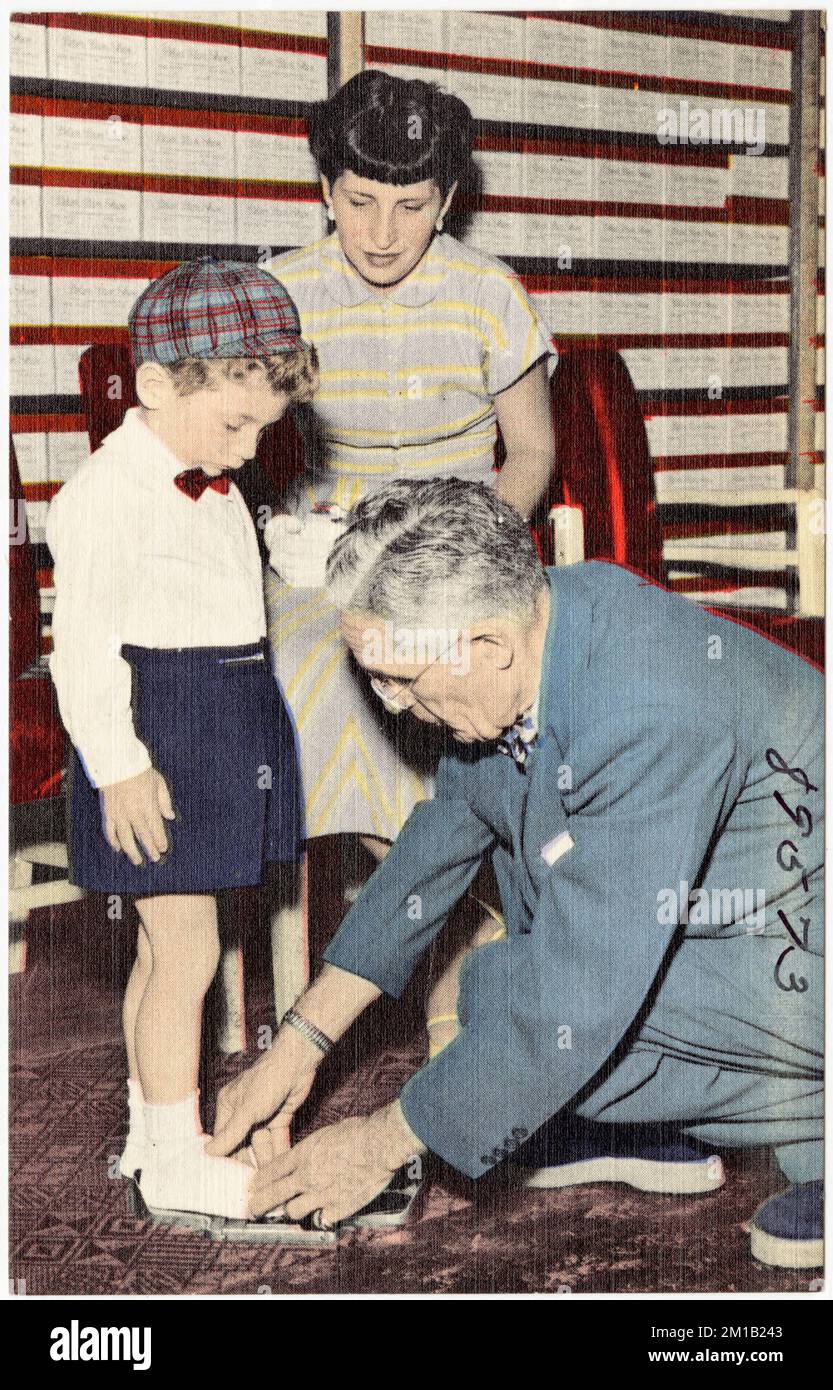 View of store clerk measuring a child's foot , Tichnor Brothers ...