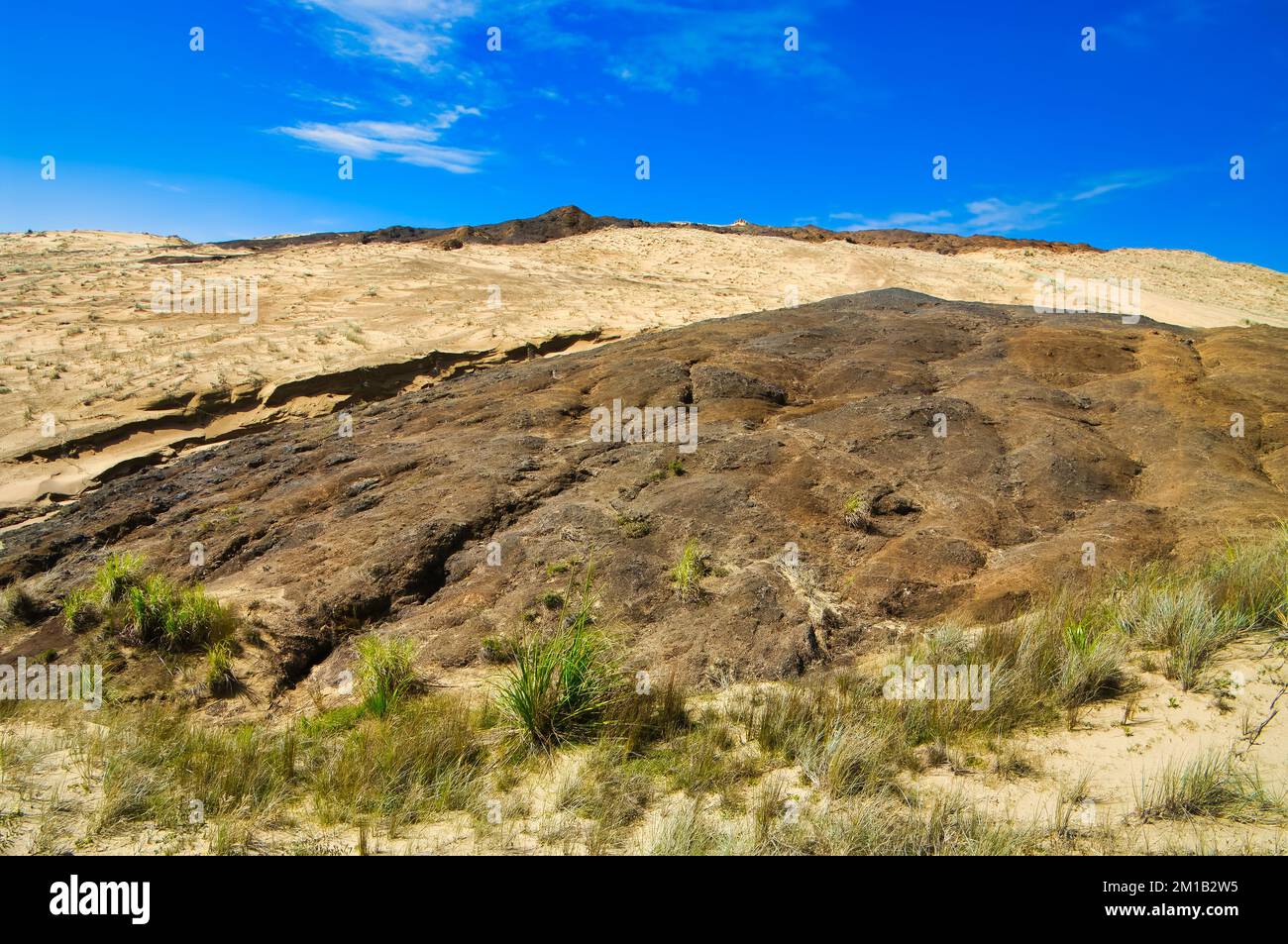 Huge sand dunes and eroded rocks at Cape Maria van Diemen, in the ...
