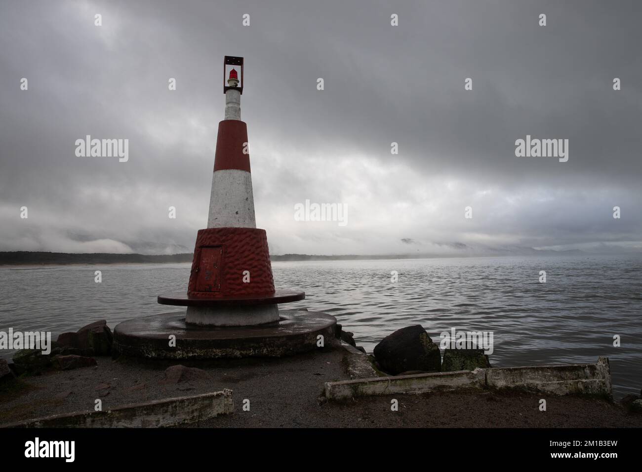 A seascape view with a lighthouse on a gloomy day Bintan, Indonesia ...