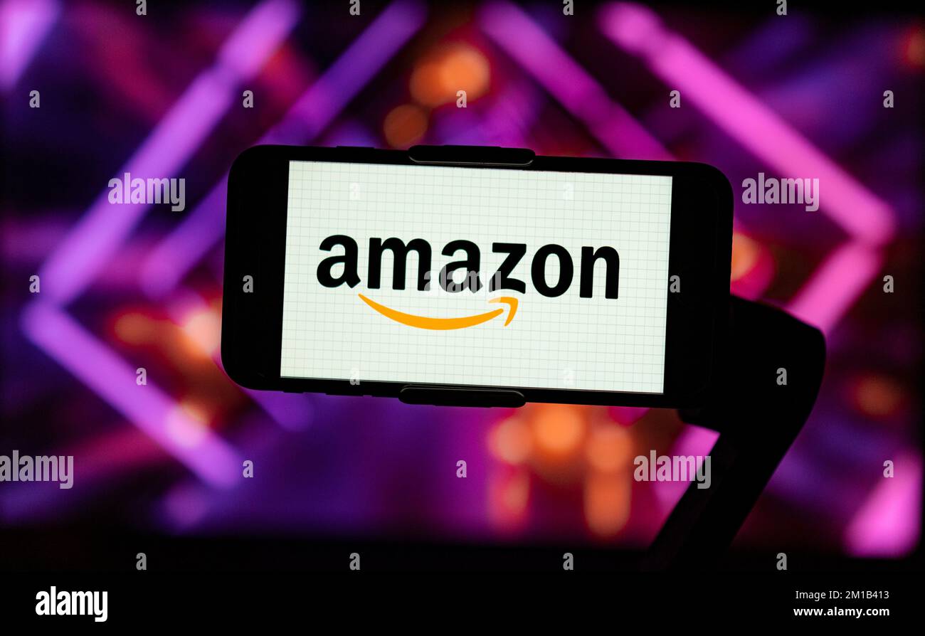 In this photo illustration, the logo of Amazon is seen displayed on a ...